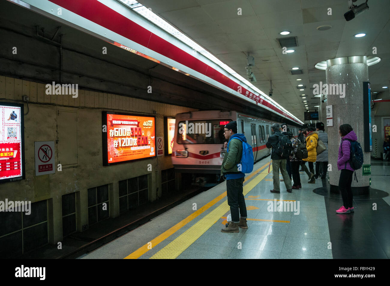 Passenger waiting for a train on Line 1 of the Beijing subway at ...