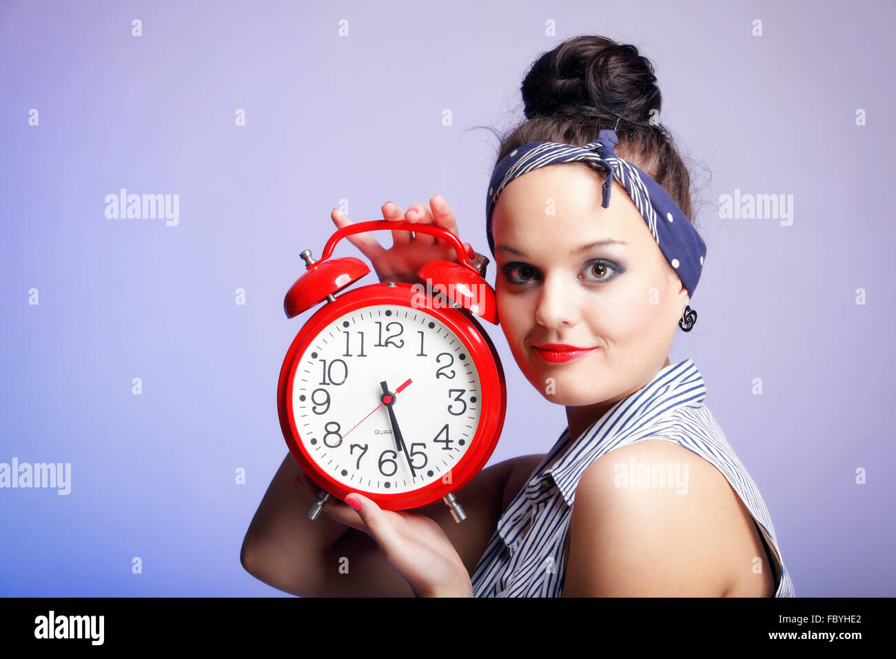 Woman with red clock. Time management concept Stock Photo - Alamy
