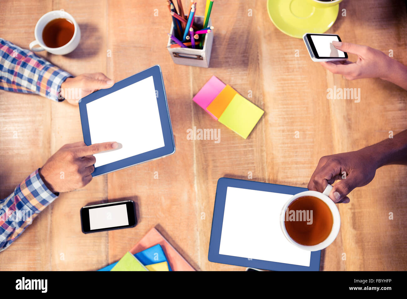 Cropped image of business people using technologies Stock Photo - Alamy