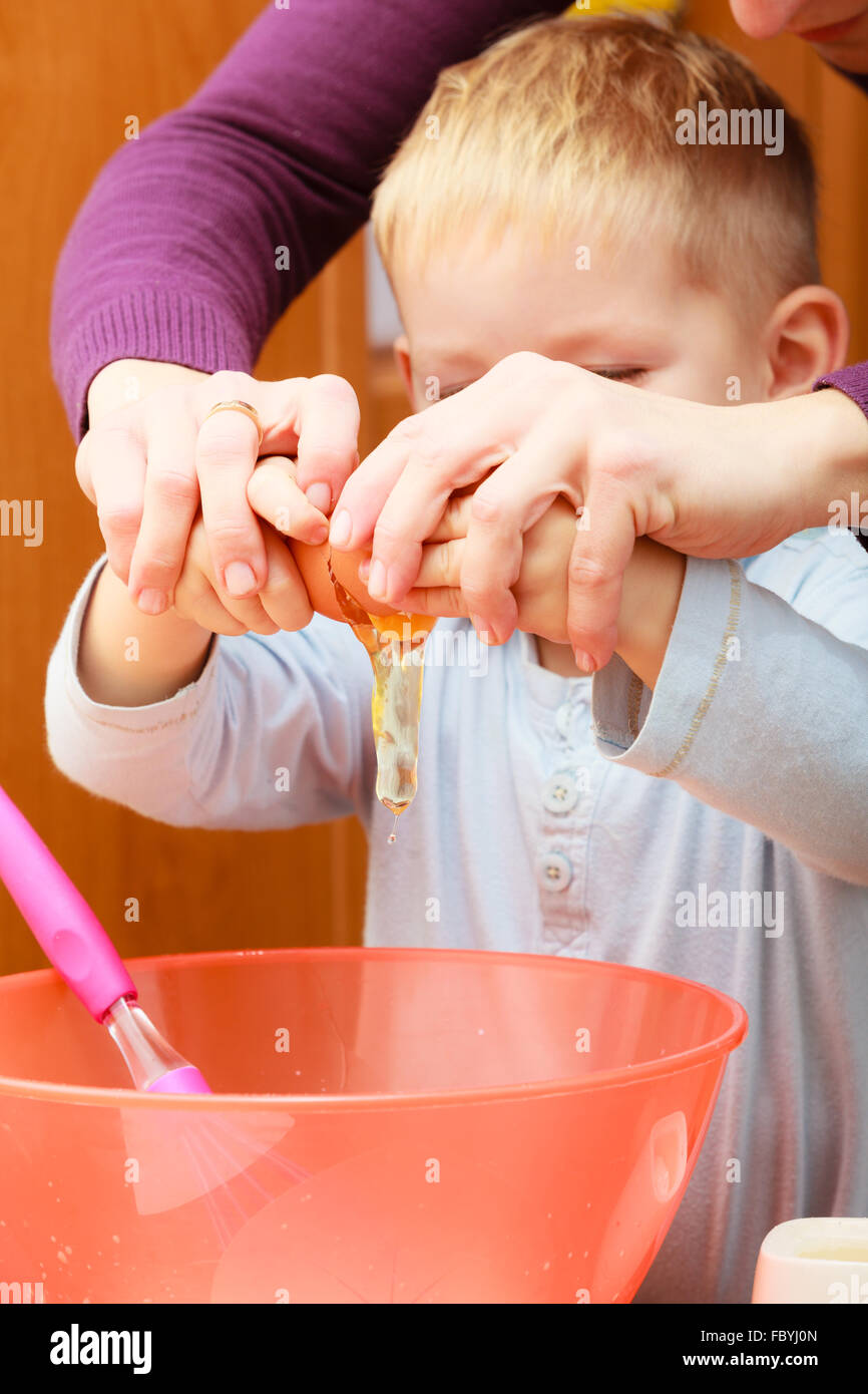 Boy breaking an egg hi-res stock photography and images - Alamy