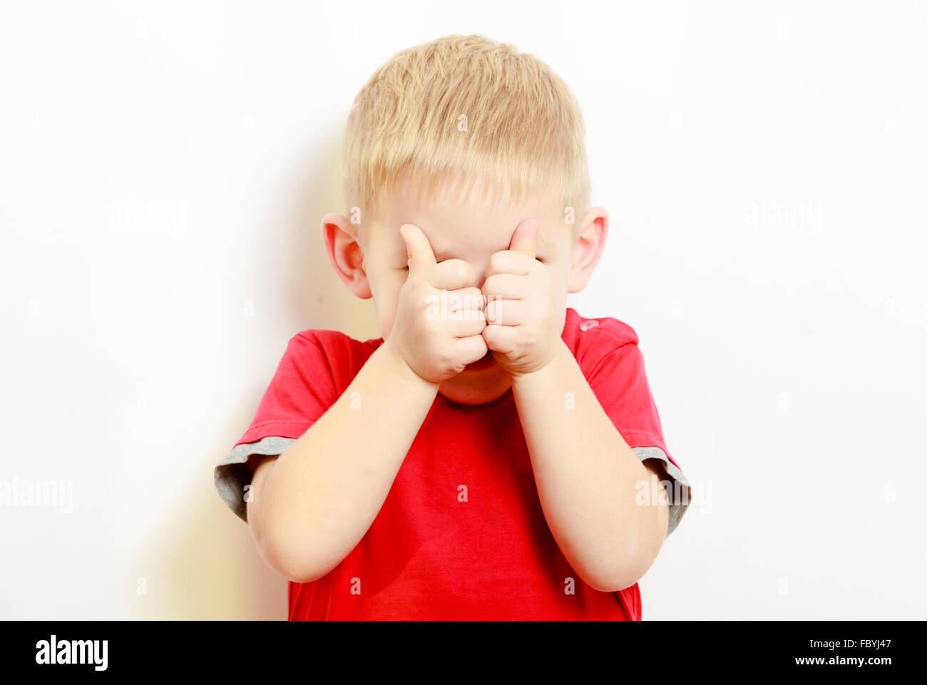 Happy childhood. Smiling blond boy child kid showing thumb up Stock ...