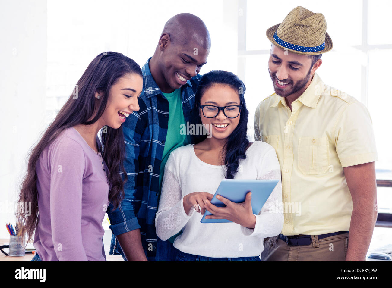 Creative team using tablet hi-res stock photography and images - Alamy