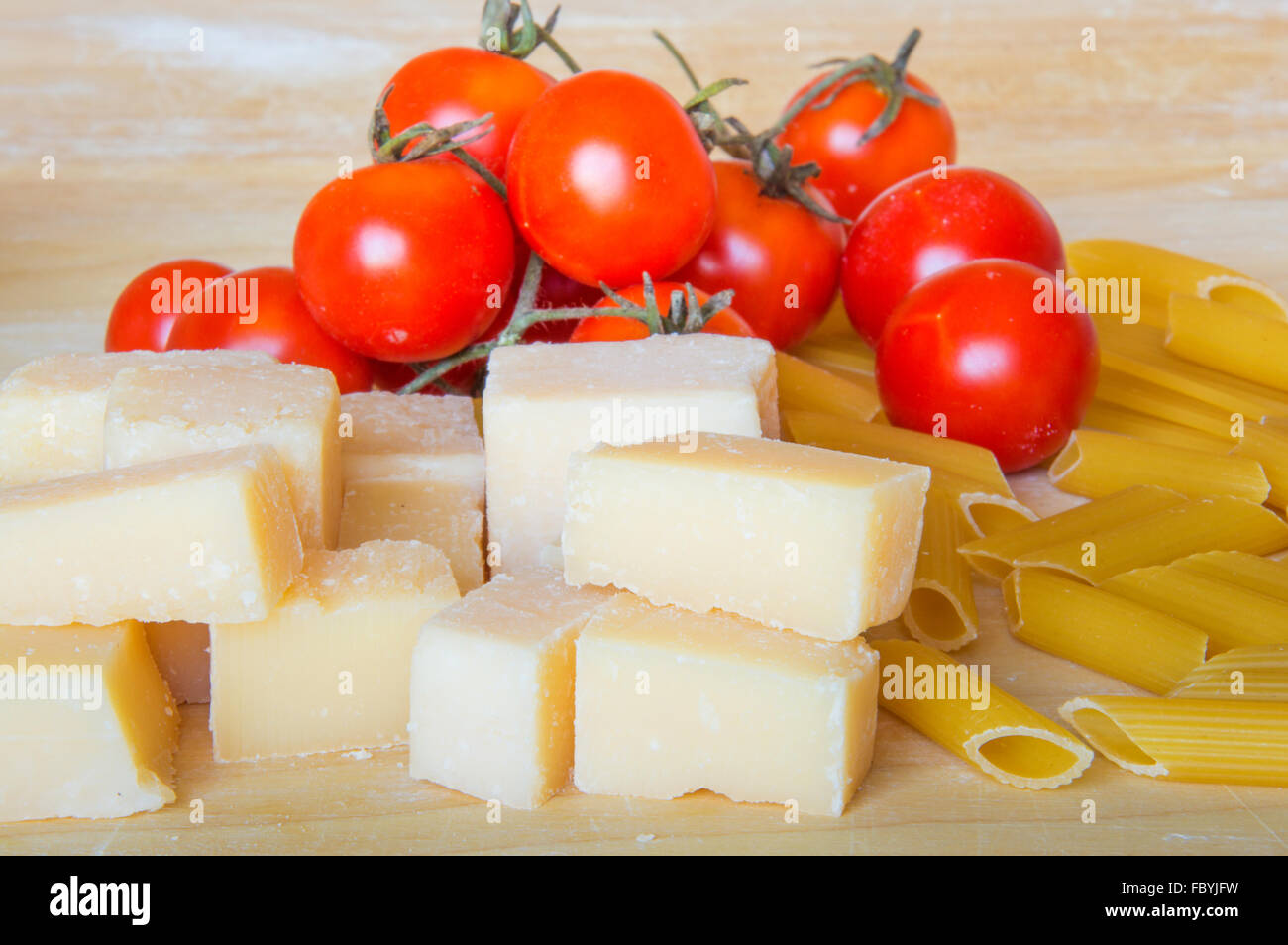 Italian grana padano with pasta and tomatoes Stock Photo - Alamy