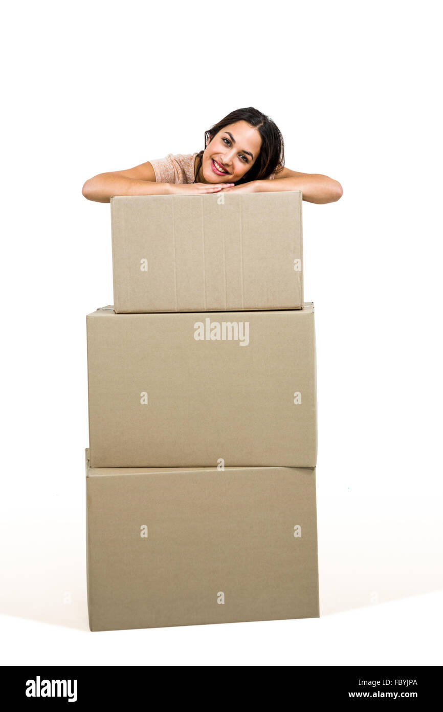 Portrait of woman standing behind cardboard box Stock Photo - Alamy