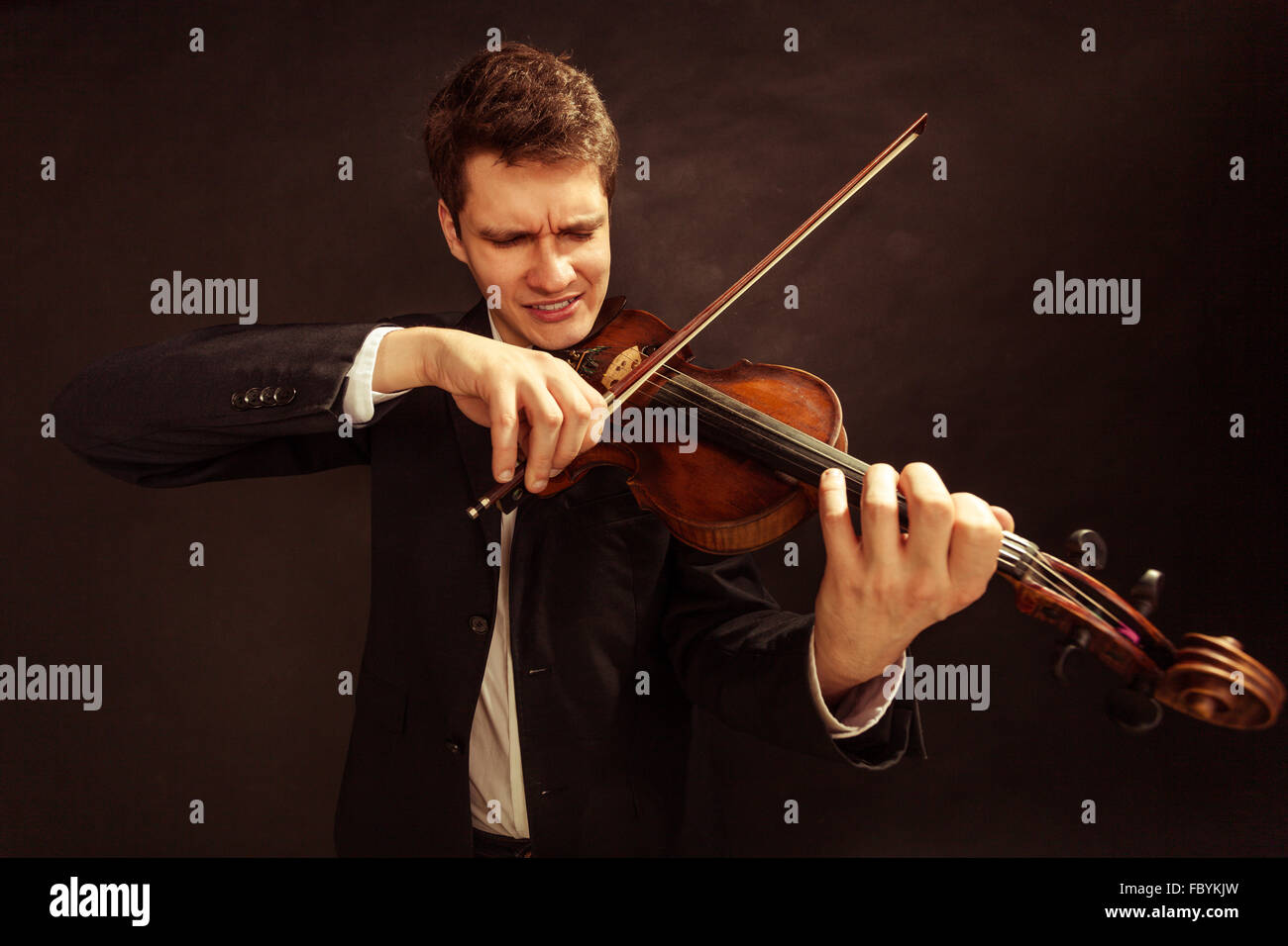 Man violinist playing violin. Classical music art Stock Photo - Alamy