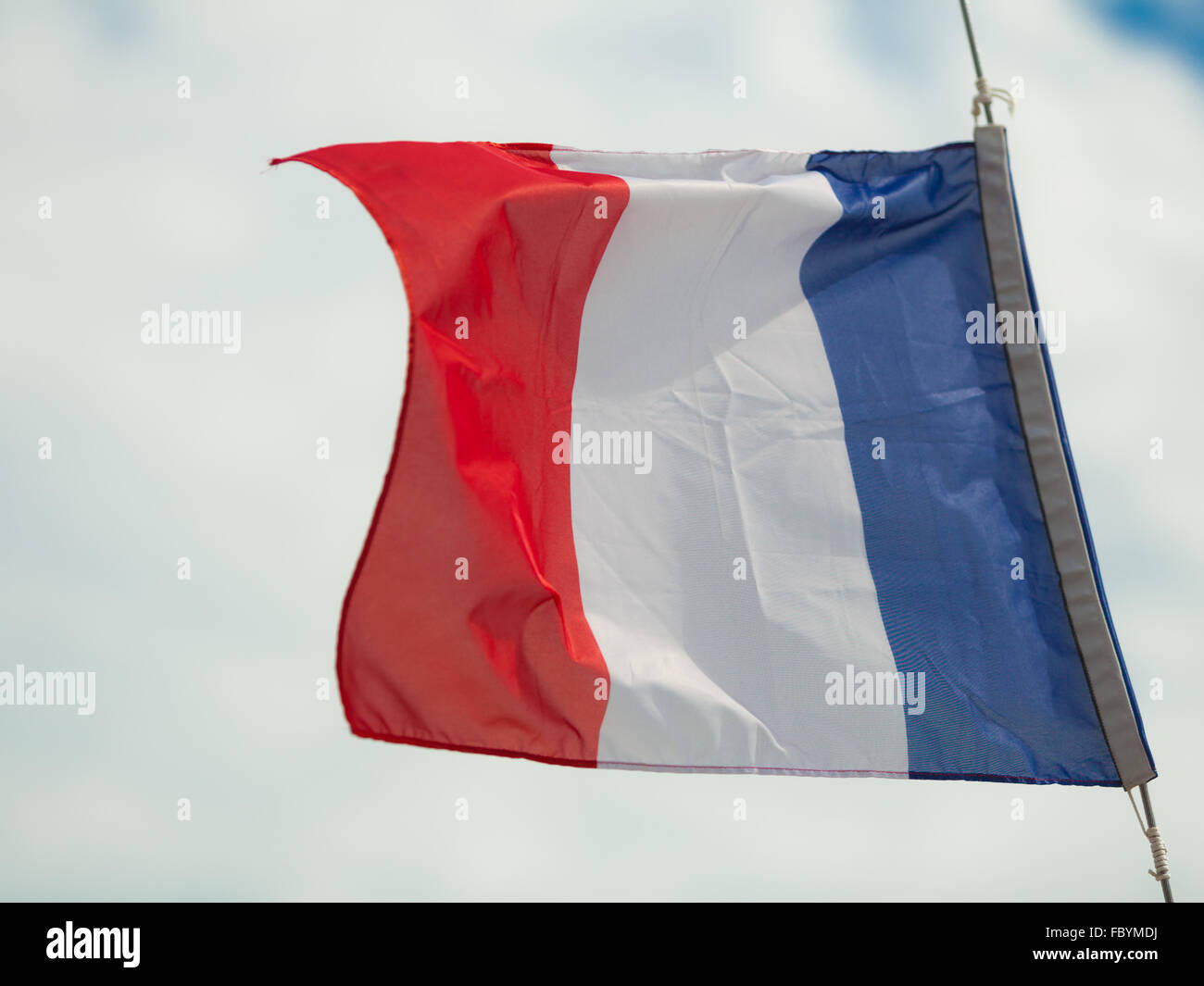 Full flag of France blue sky background Stock Photo - Alamy