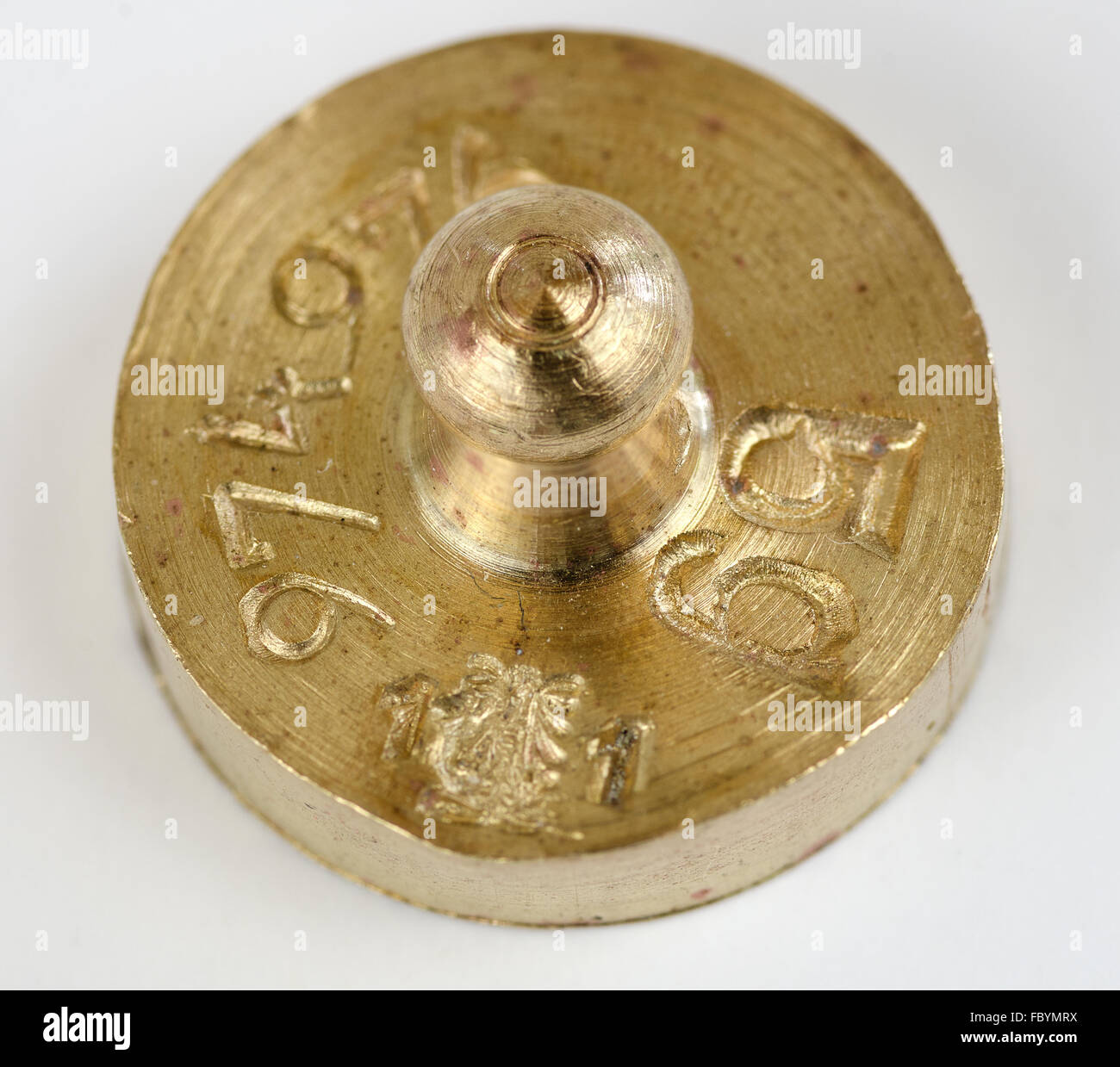 weight of five grams made from brass Stock Photo - Alamy