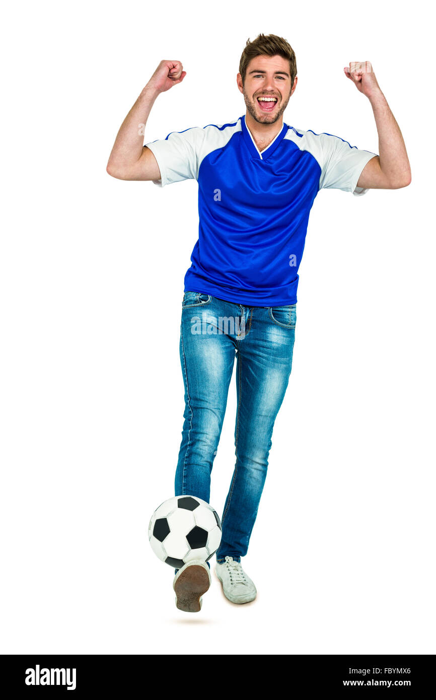 Smart man holding football with arms raised Stock Photo - Alamy
