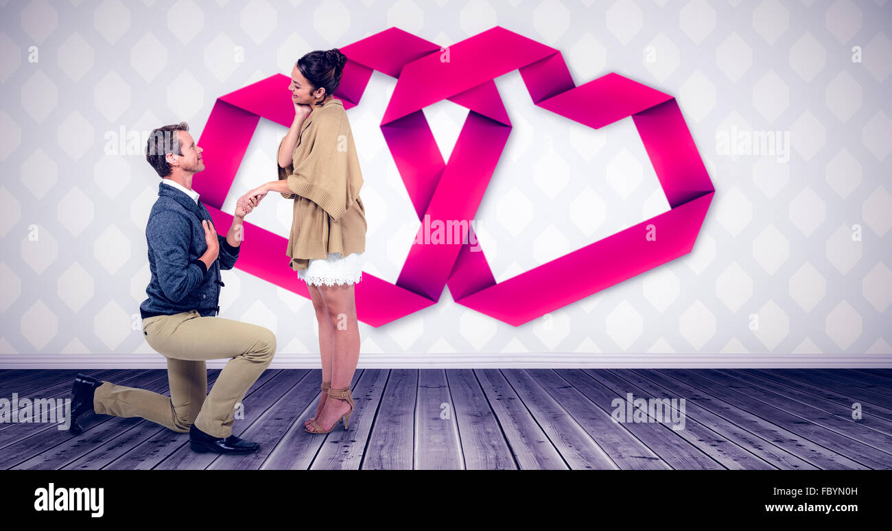 Composite image of handsome man proposing woman while kneeling Stock ...