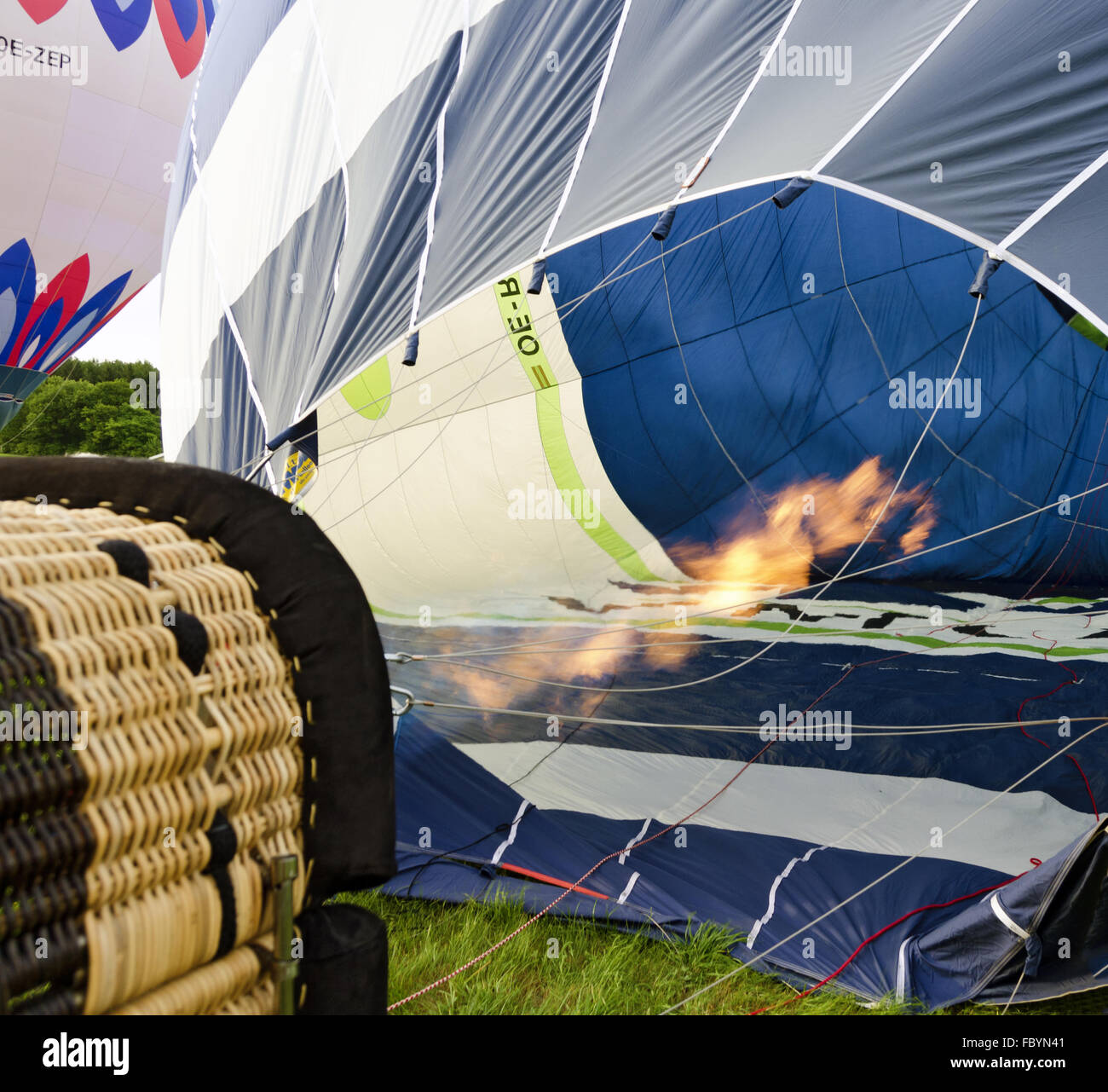 laying hot-air balloon and big gas flame Stock Photo - Alamy