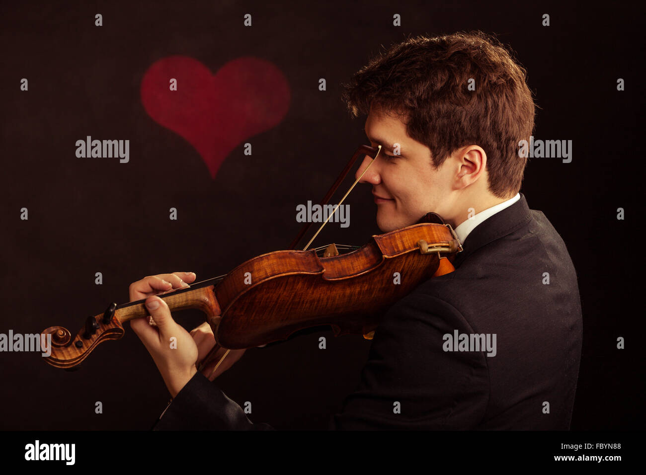 Man violinist playing violin. Classical music art Stock Photo - Alamy