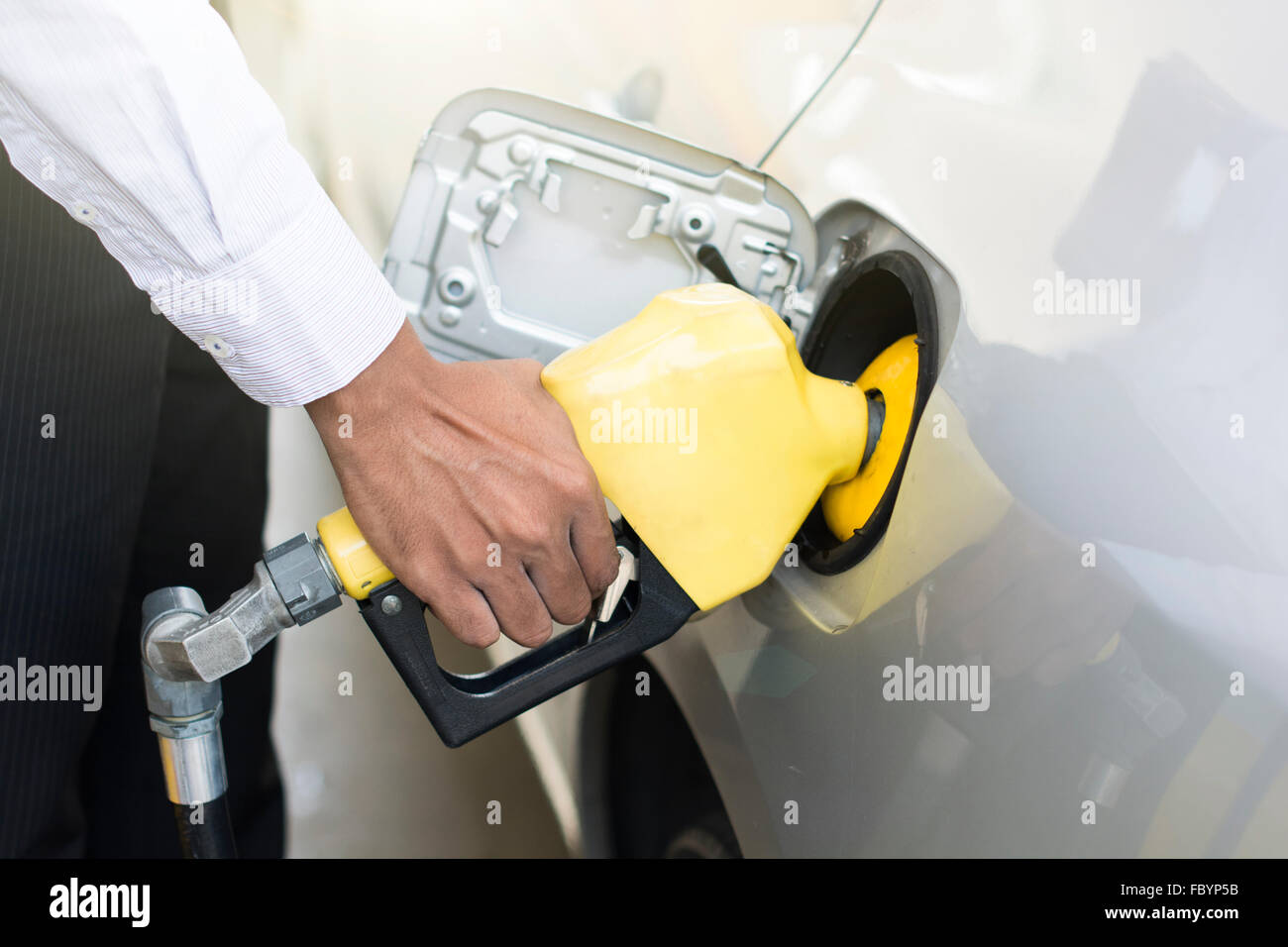 indian male pumping fuel Stock Photo - Alamy
