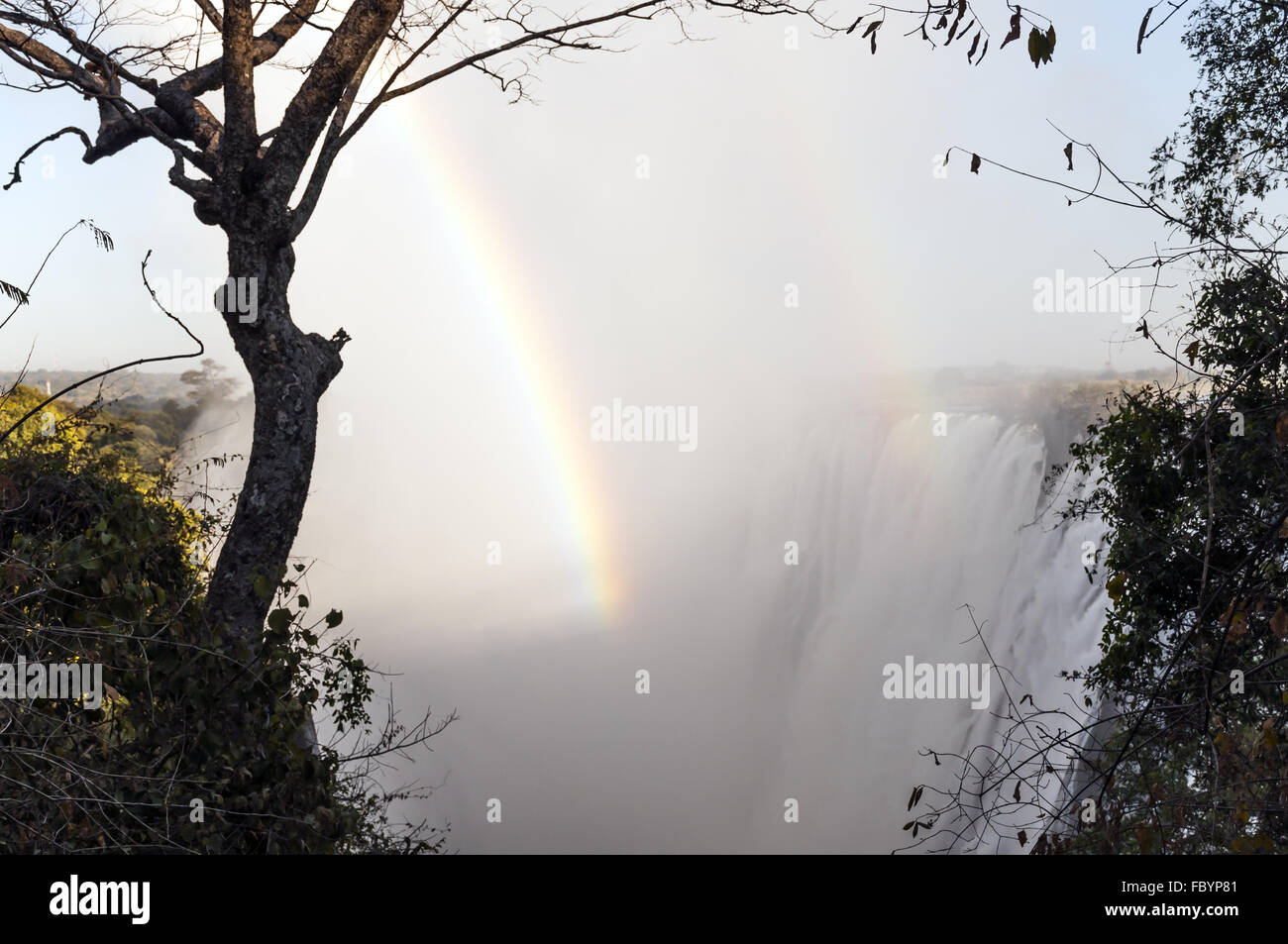 Rainbow Over Victoria Falls Stock Photo - Alamy