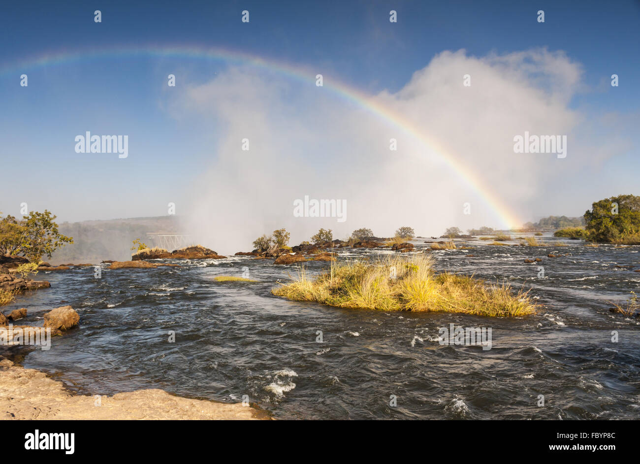Rainbow Over Victoria Falls Stock Photo - Alamy