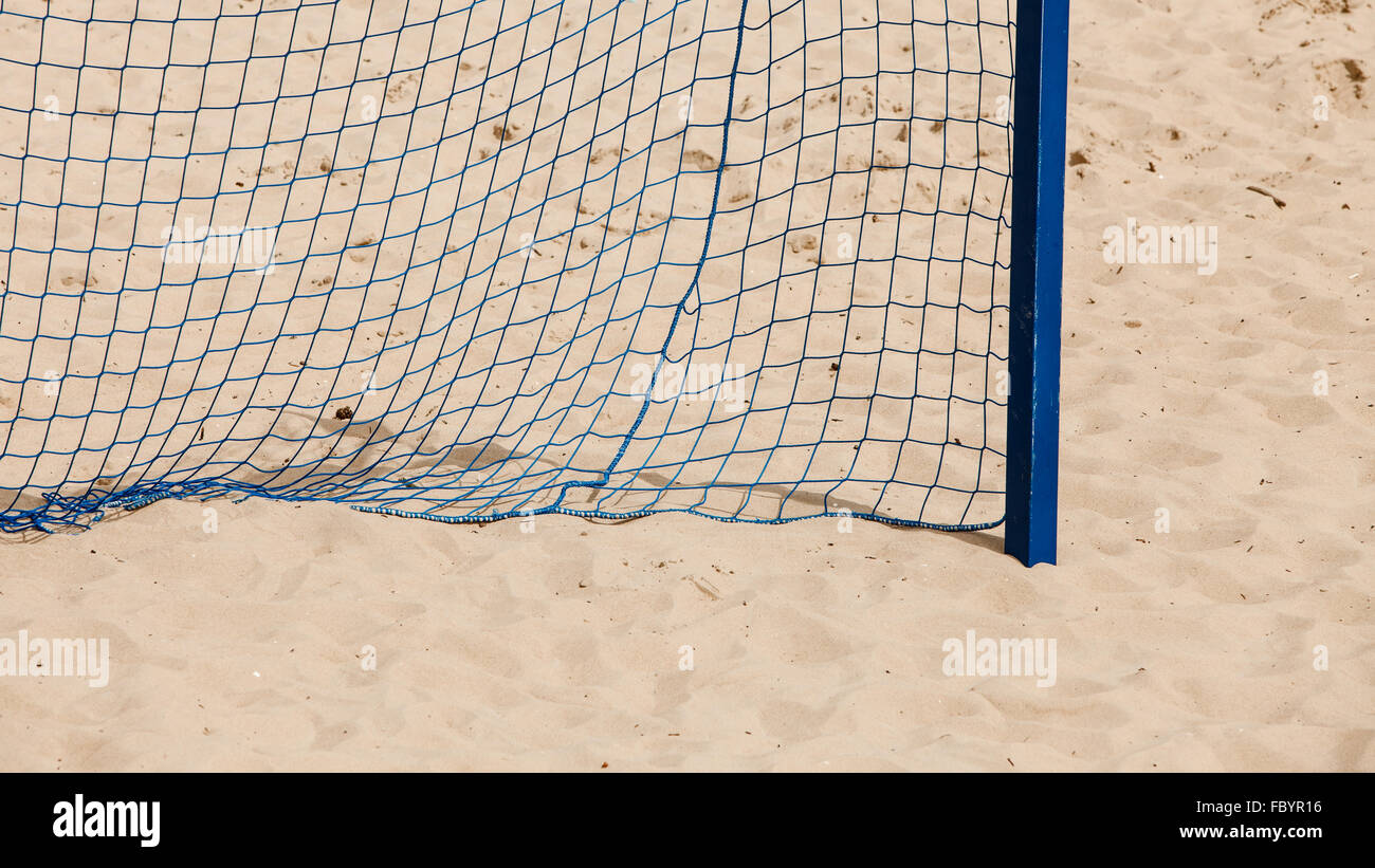 Football summer sport. goal net on a sandy beach Stock Photo - Alamy