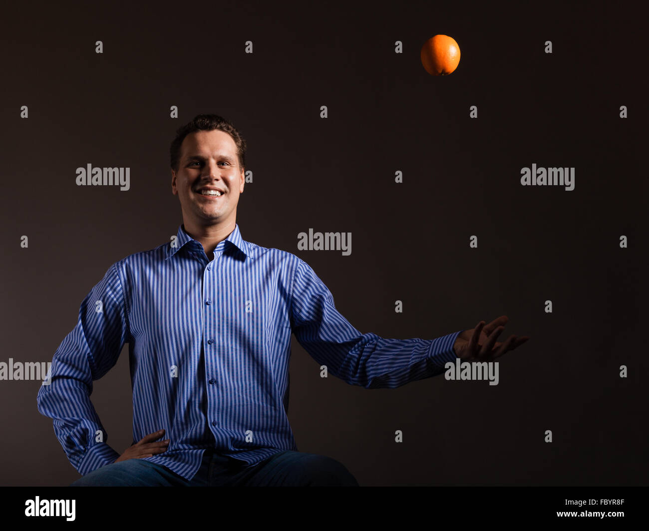 Tossing orange hi-res stock photography and images - Alamy