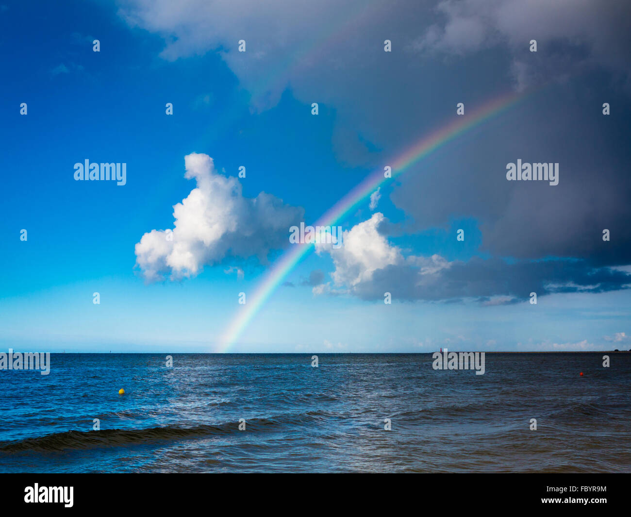 landscape view on sky with rainbow at sea Stock Photo - Alamy
