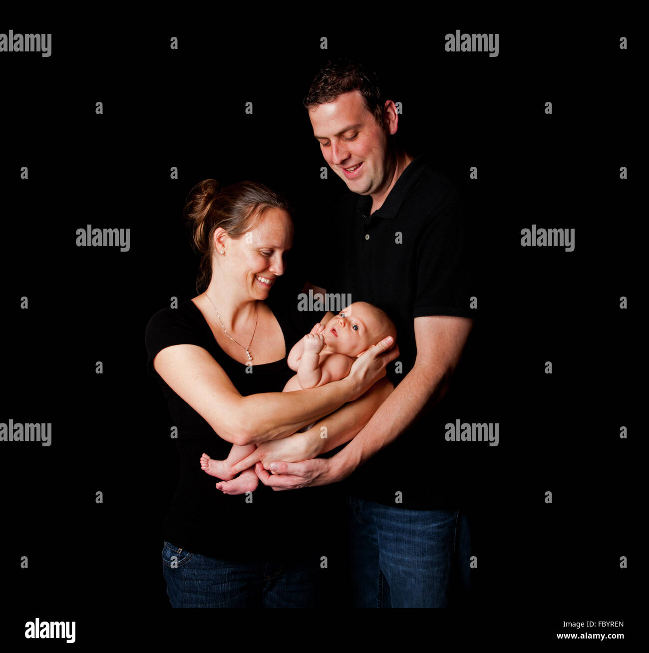 Happy new family Stock Photo - Alamy