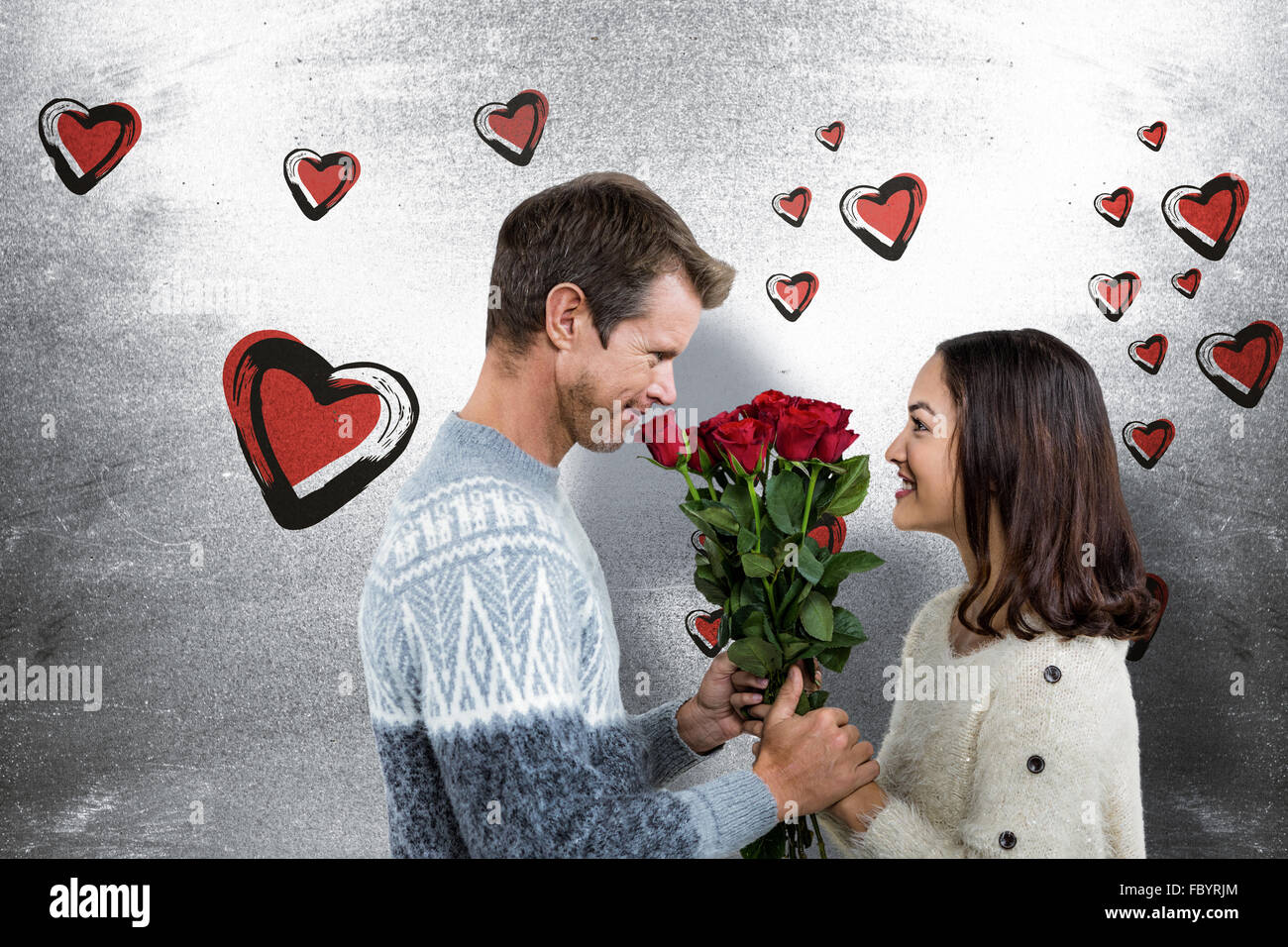 Composite image of romantic couple holding red roses Stock Photo - Alamy