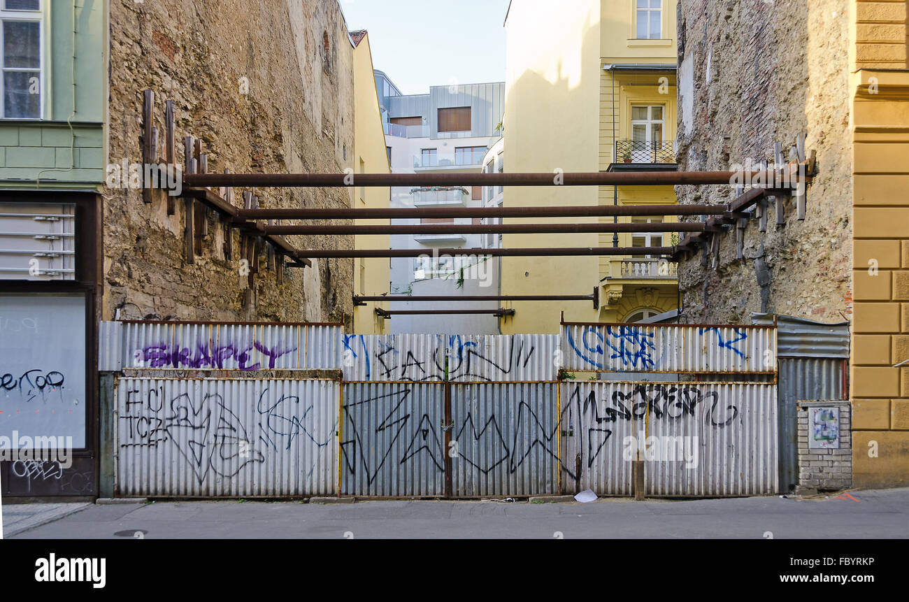 steel beams in a gap between two houses Stock Photo - Alamy