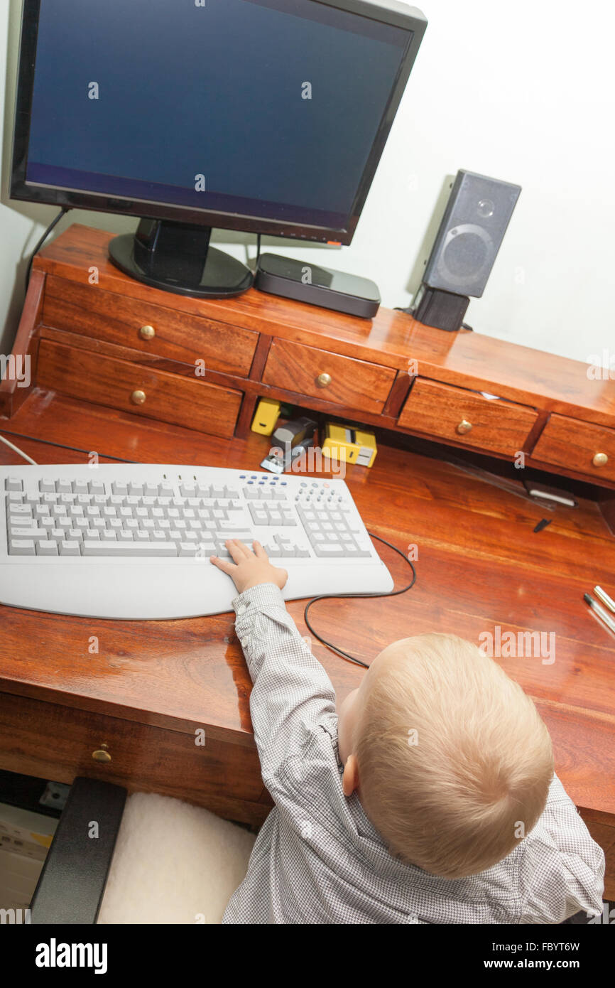 Little boy child kid playing on the computer Stock Photo - Alamy
