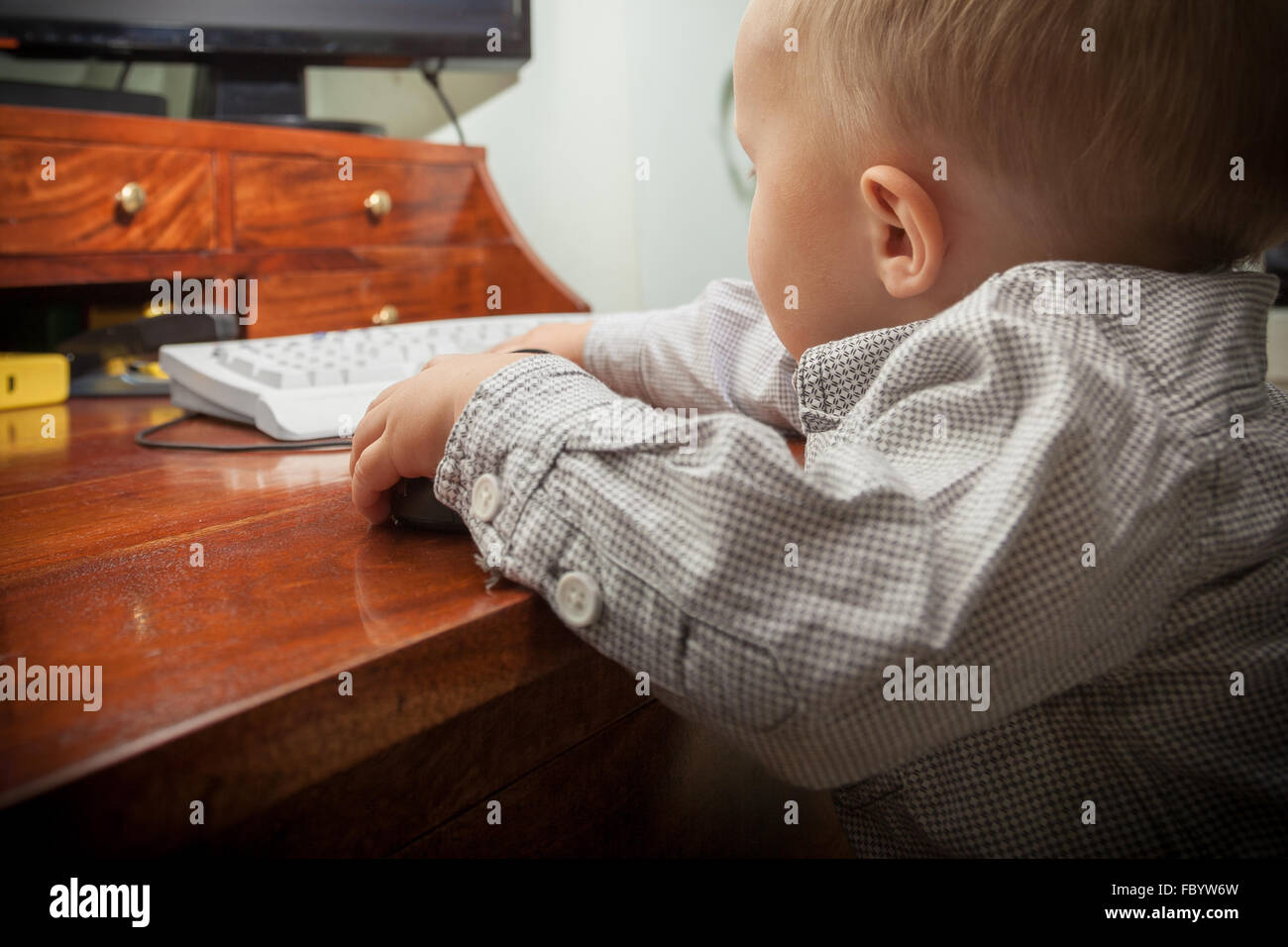 Little boy child kid playing on the computer Stock Photo - Alamy