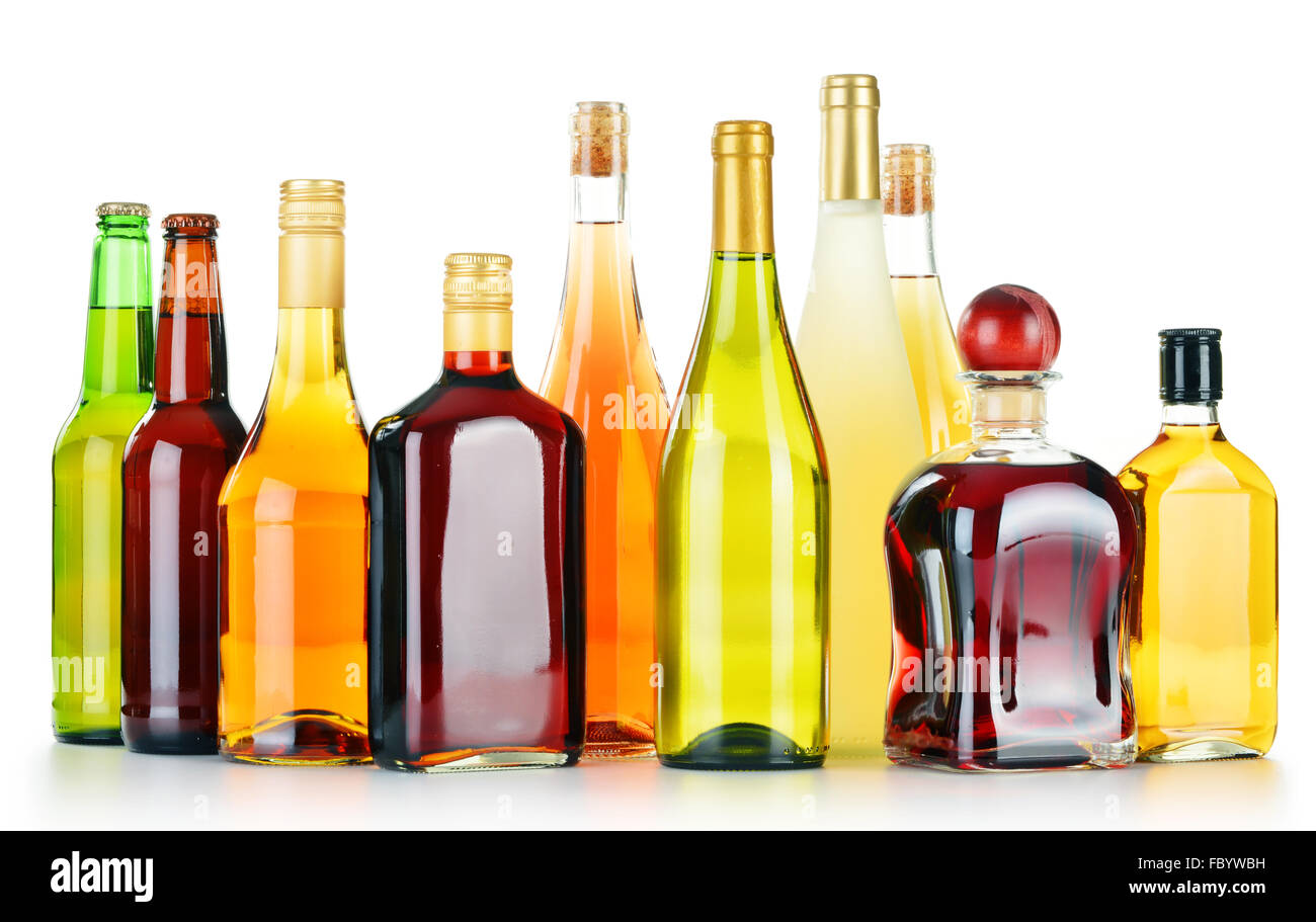 Bottles of assorted alcoholic beverages isolated on white background ...