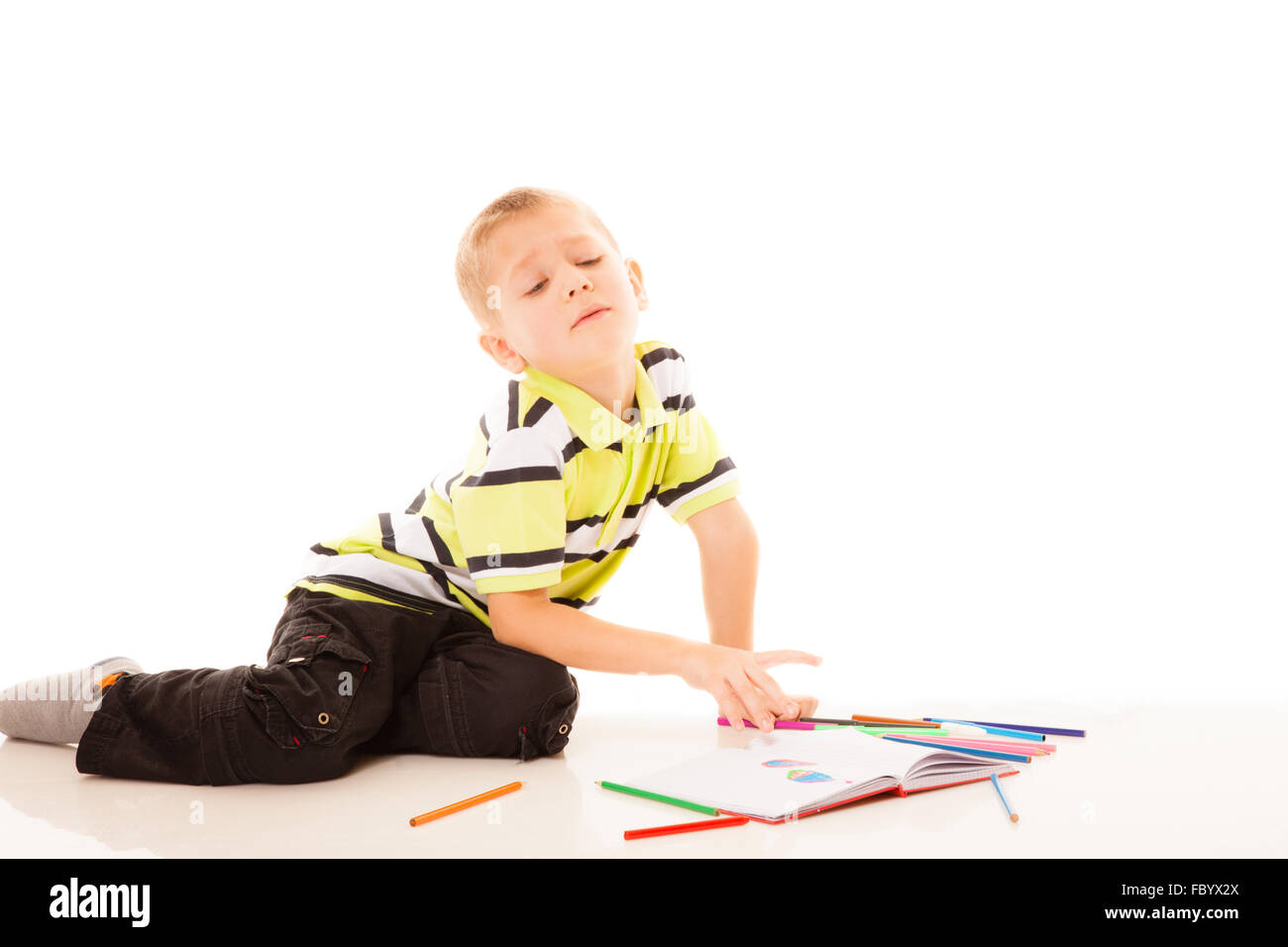 little boy child drawing with color pencils Stock Photo - Alamy