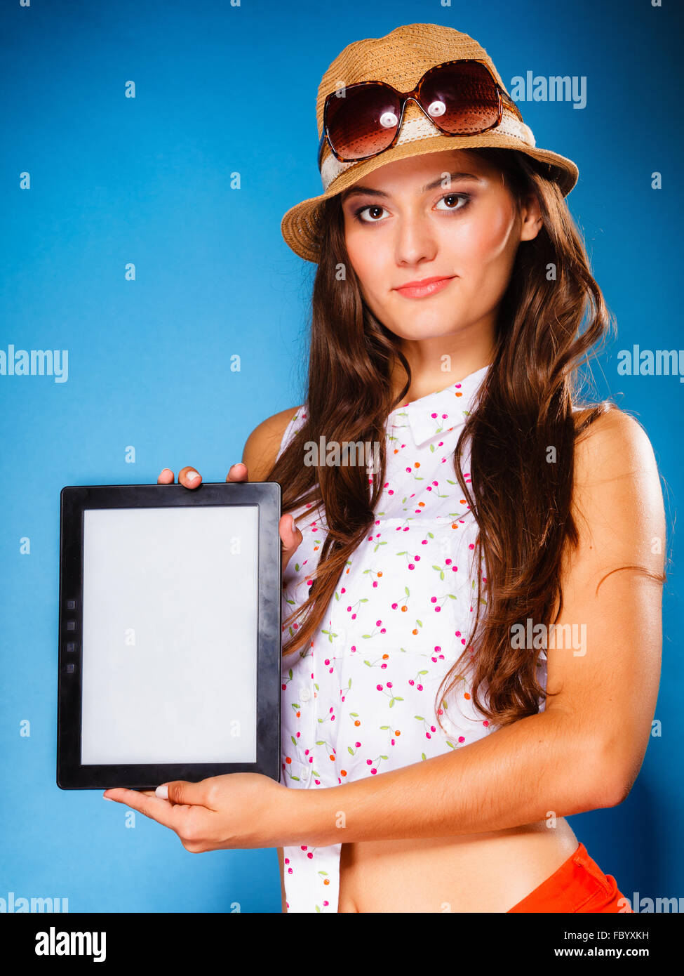Girl showing blank copy space screen of tablet touchpad Stock Photo - Alamy