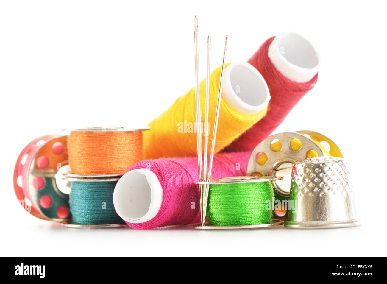 Tailor needles and threads over white background Stock Photo - Alamy