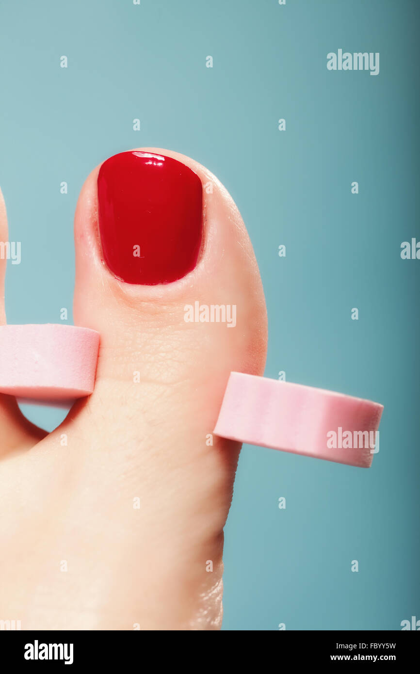 Woman feet red toenails on hi-res stock photography and images - Alamy