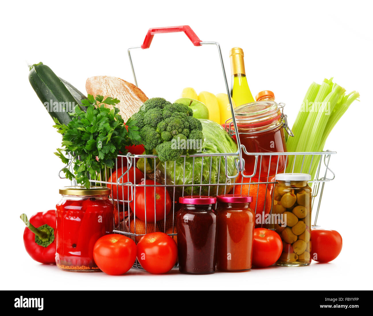 Wire shopping basket with groceries isolated on white Stock Photo - Alamy