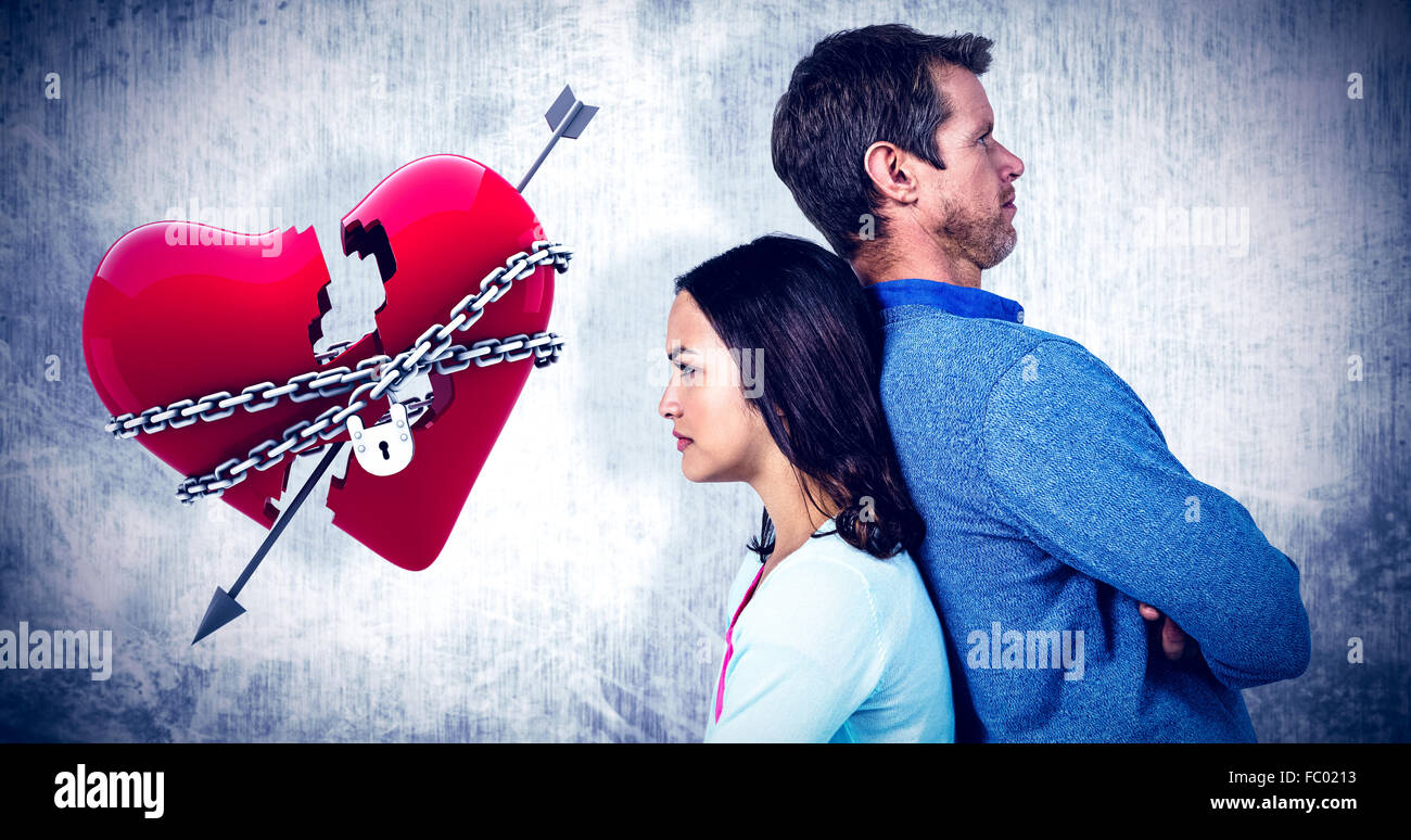 Composite image of unsmiling casual man standing Stock Photo - Alamy