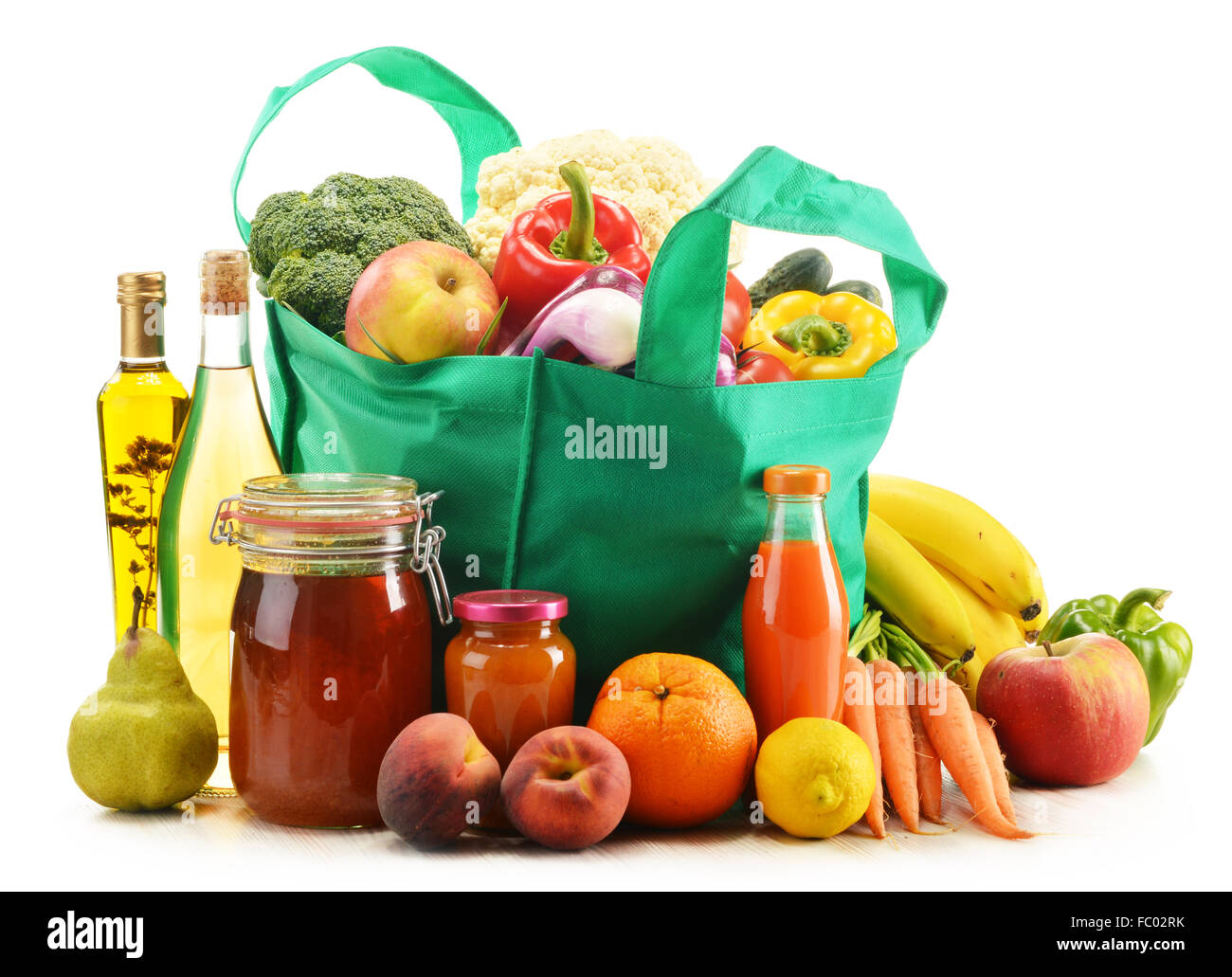 Green shopping bag with grocery products on white background Stock ...