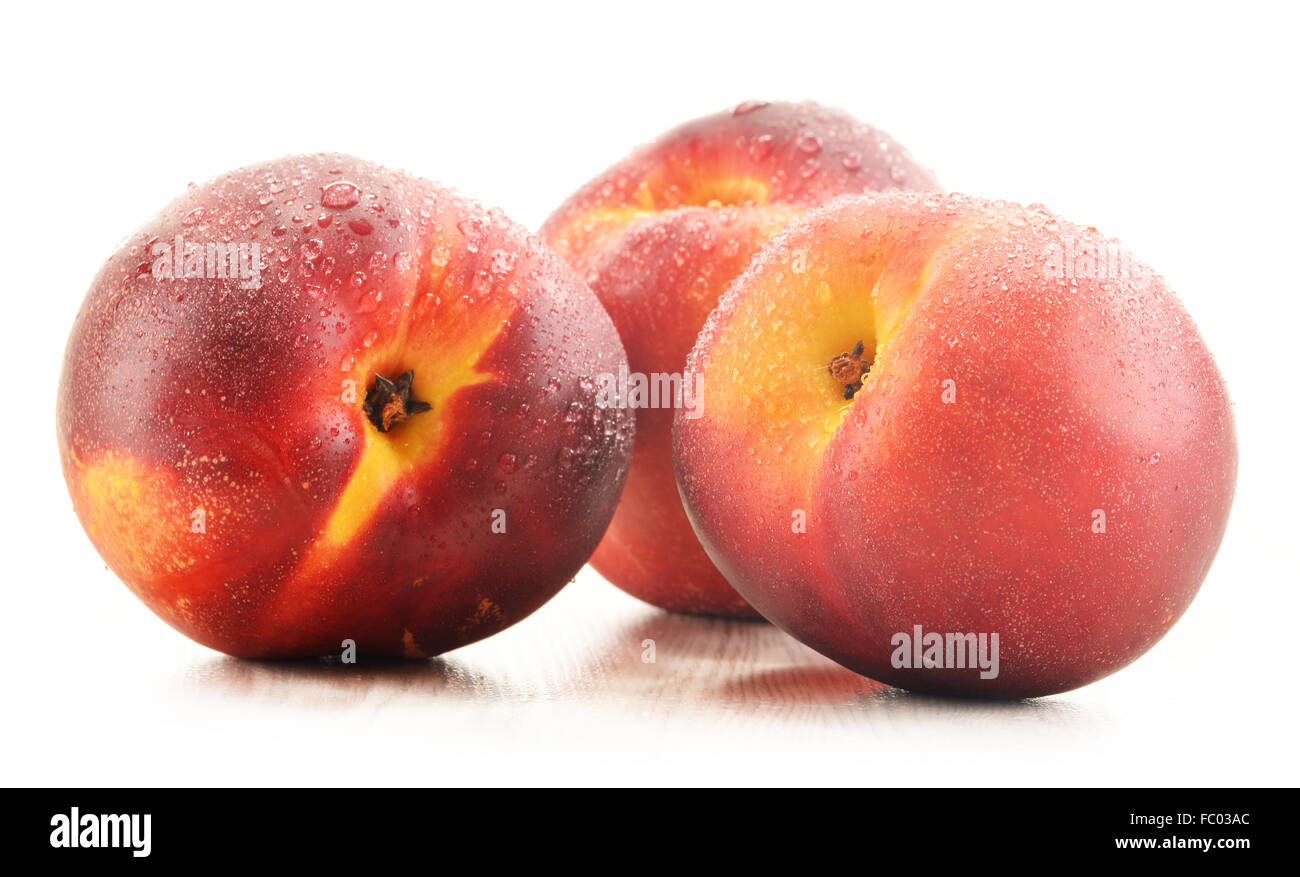 Three fresh nectarines isolated on white background Stock Photo - Alamy