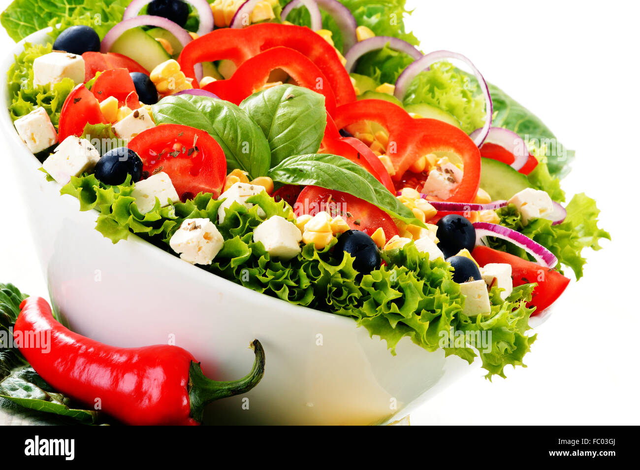 Vegetable salad bowl isolated on white background Stock Photo - Alamy