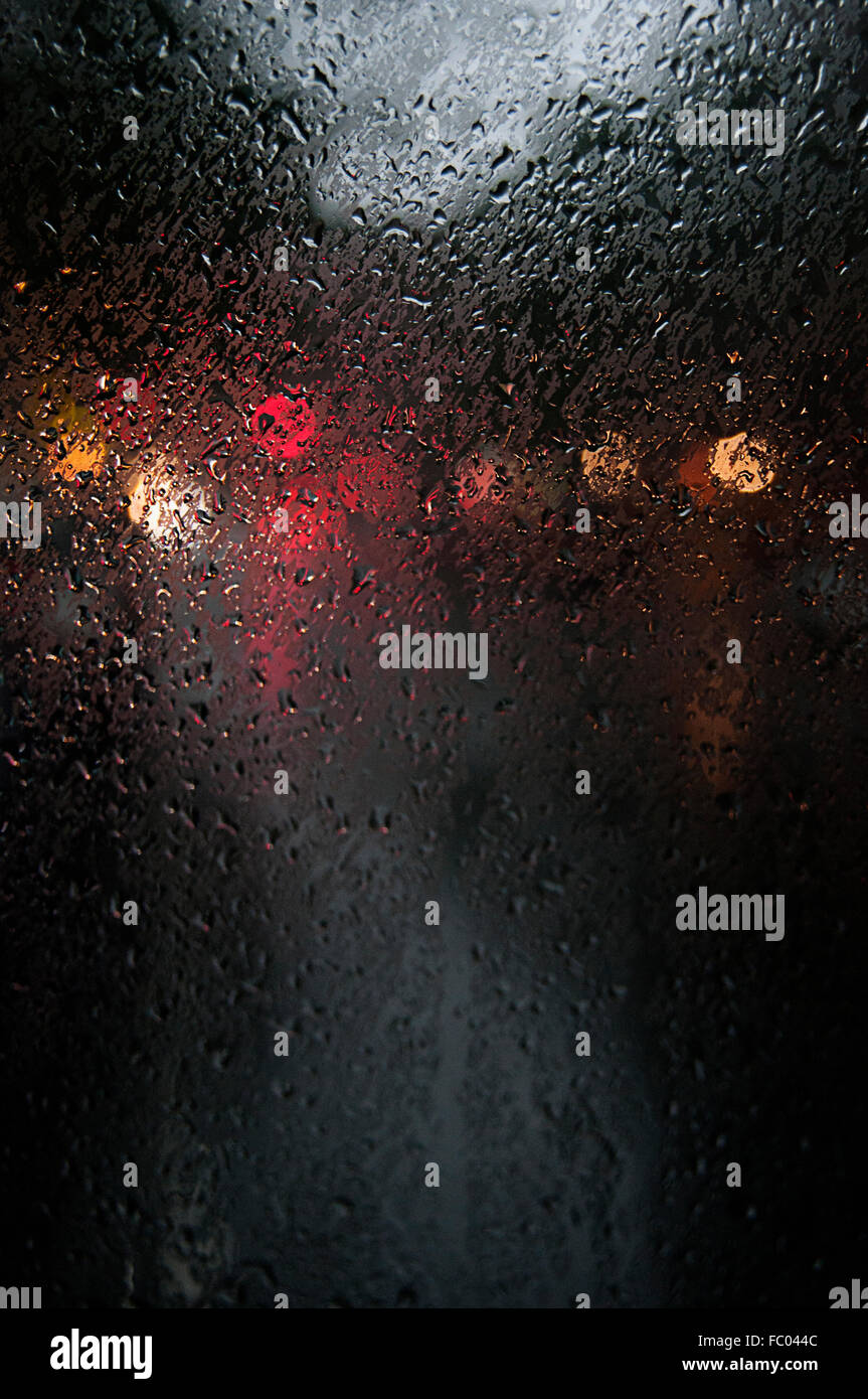 Water droplets on a car window at night in New York city Stock Photo ...