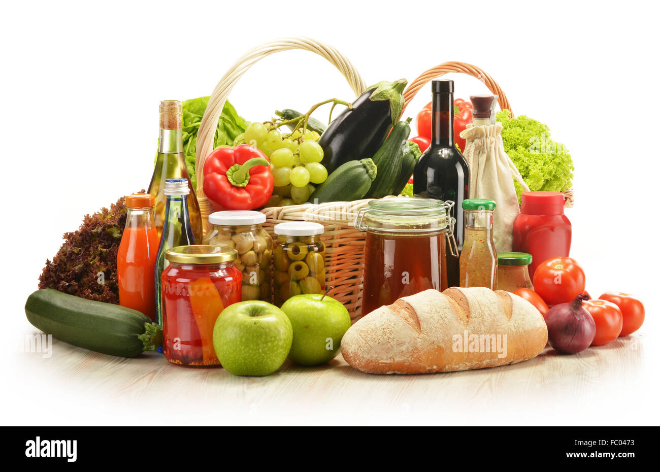 Composition with grocery products in shopping basket Stock Photo - Alamy