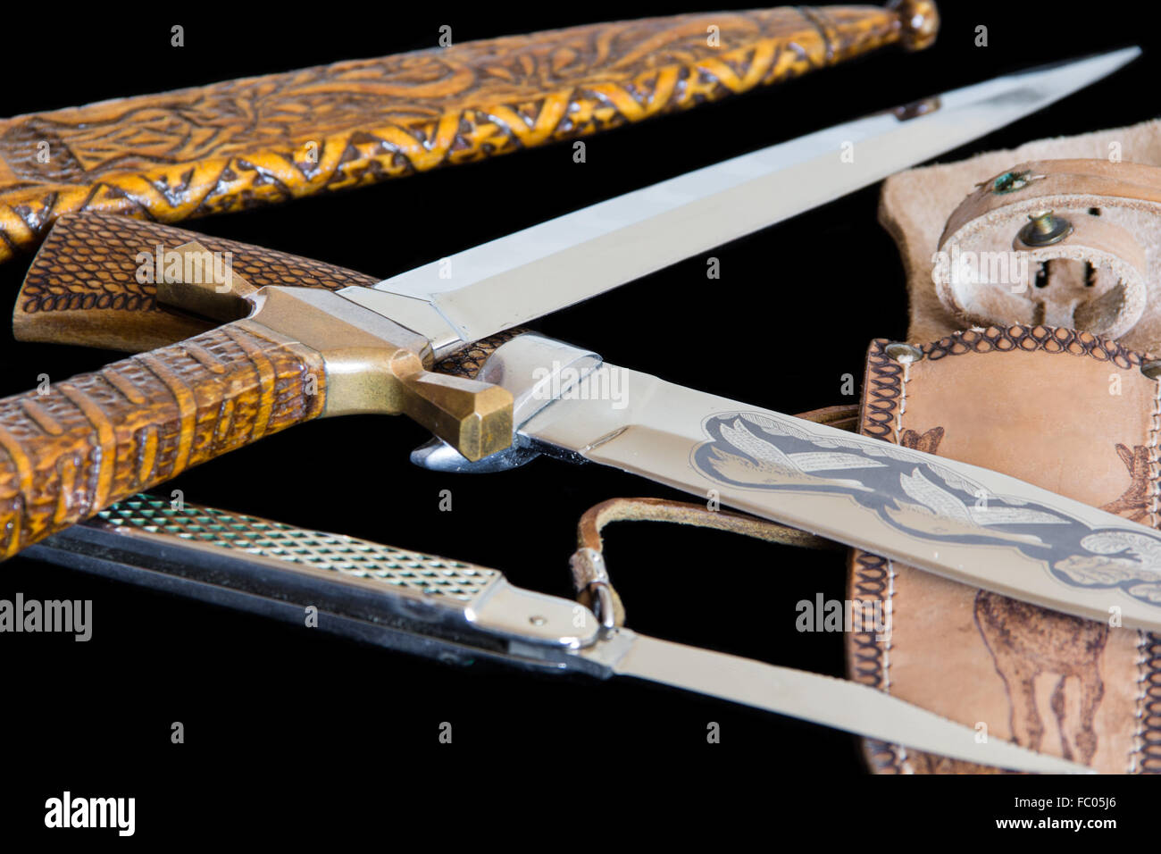 Cold weapon on black background Stock Photo - Alamy