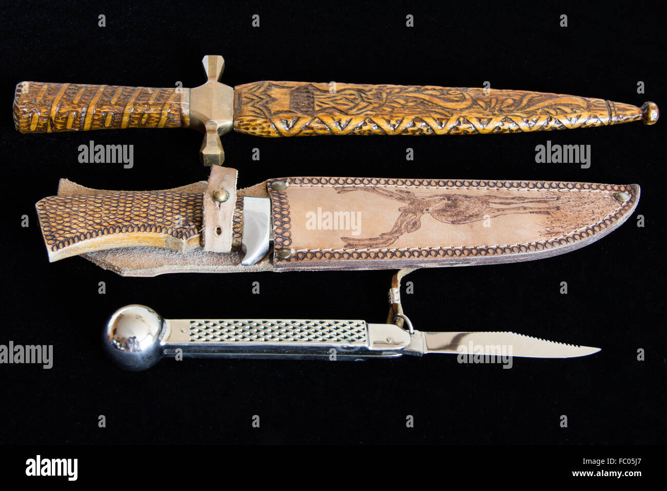 Cold weapon on black background Stock Photo - Alamy