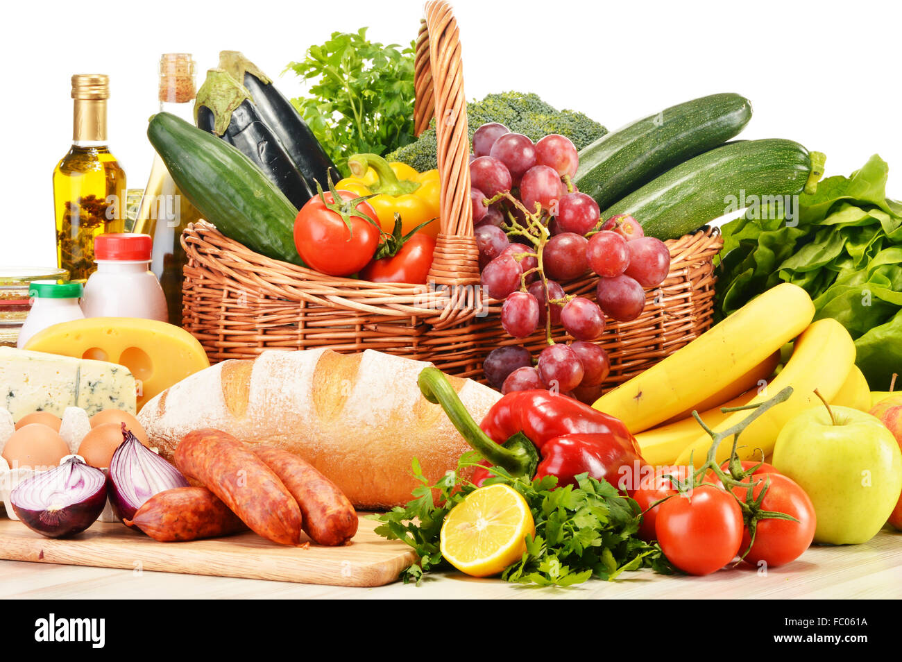 Assorted grocery products including vegetables fruits wine bread dairy ...