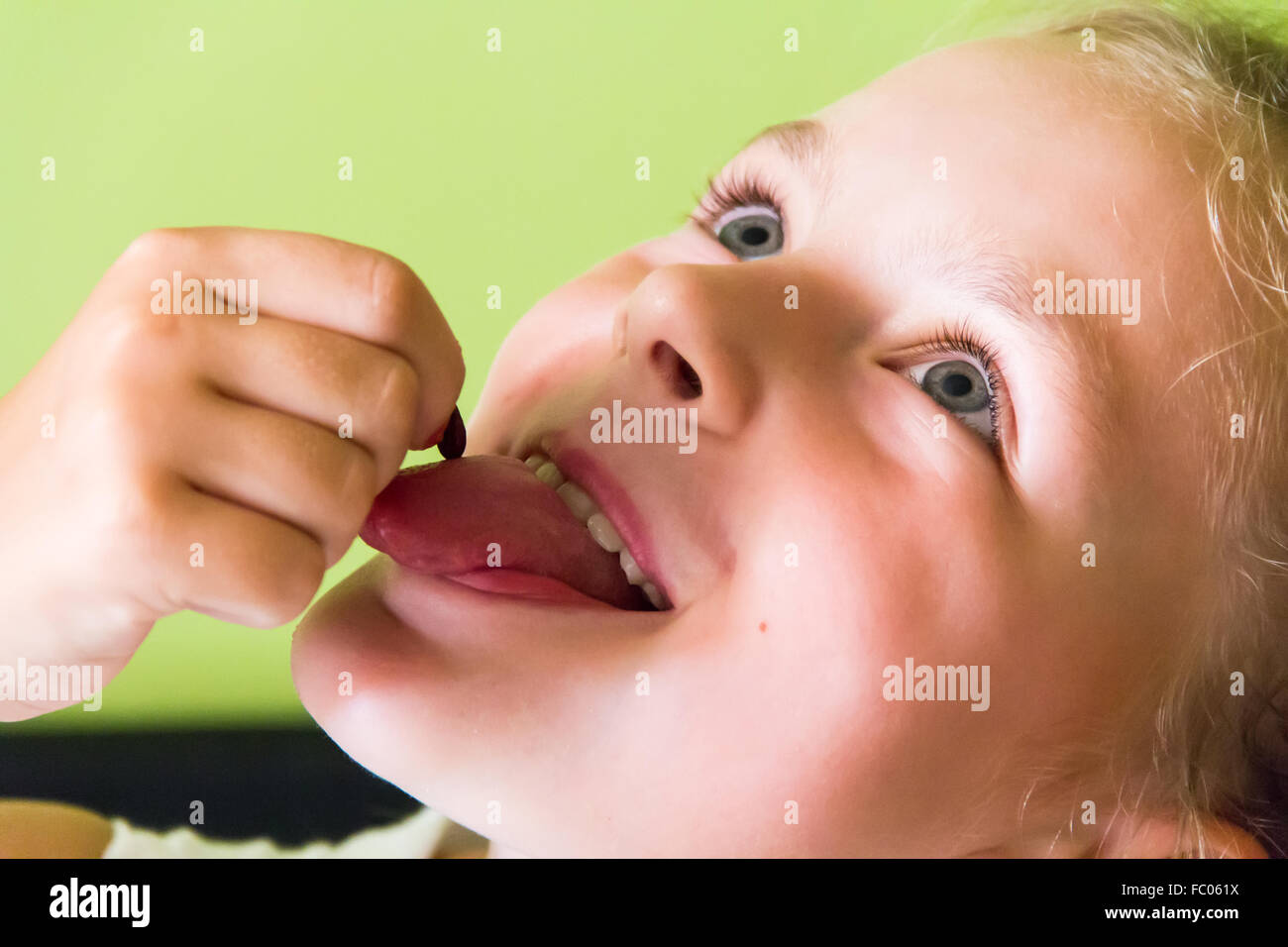 Eating cute girl Stock Photo - Alamy
