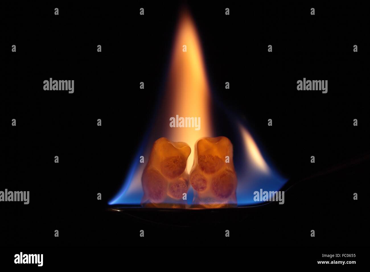 Gummy bears under fire Stock Photo - Alamy