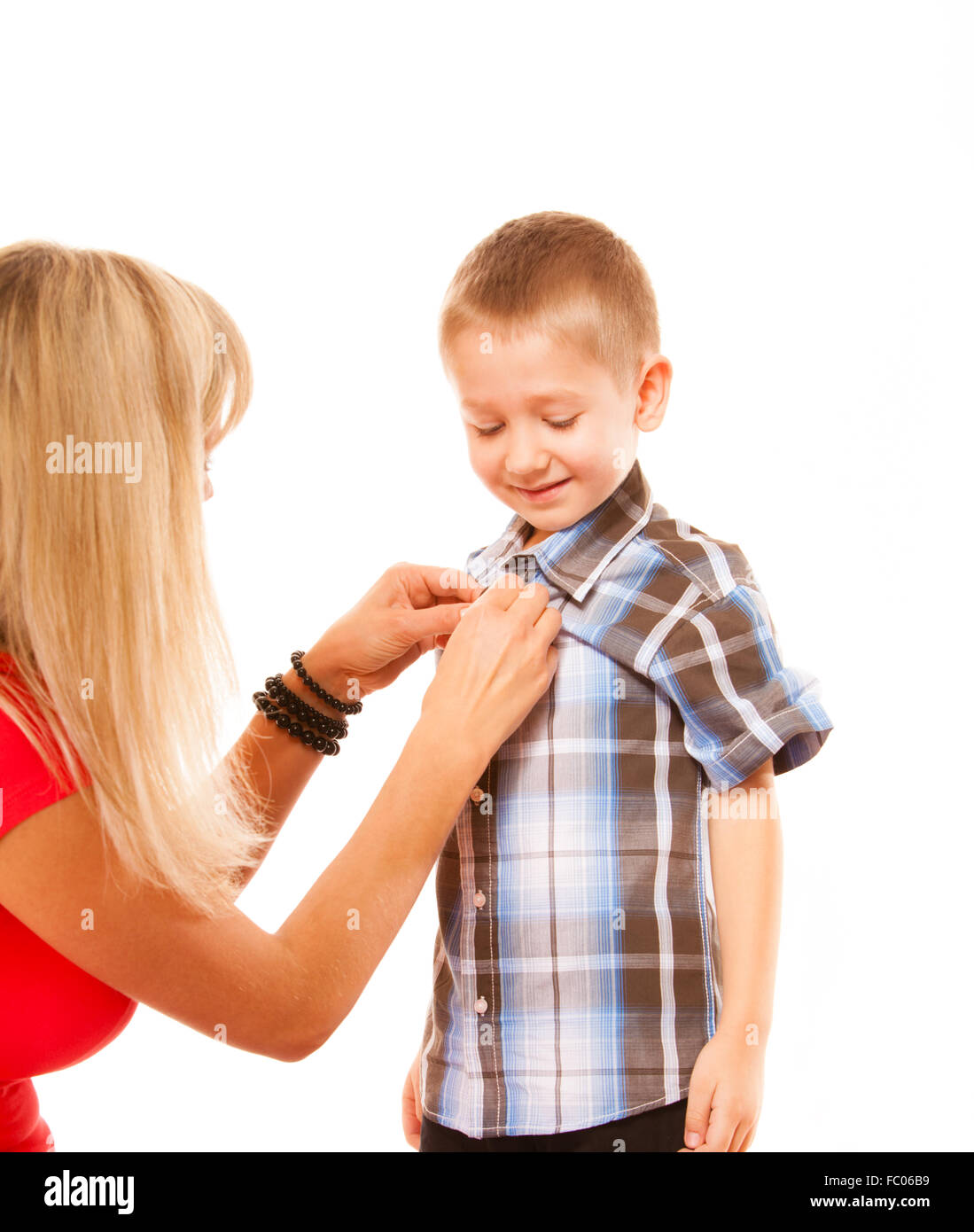 Woman buttoning her son shirt hi-res stock photography and images - Alamy