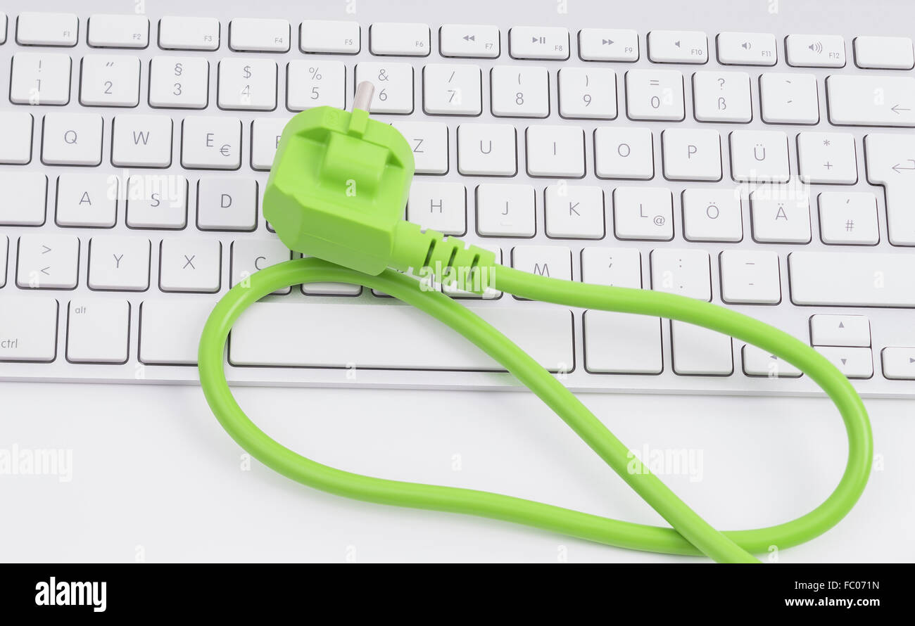 Green power cord on keyboard Stock Photo - Alamy