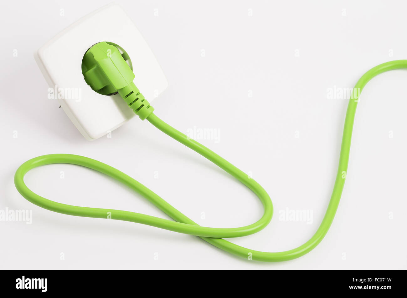 Green power plug and outlet Stock Photo - Alamy