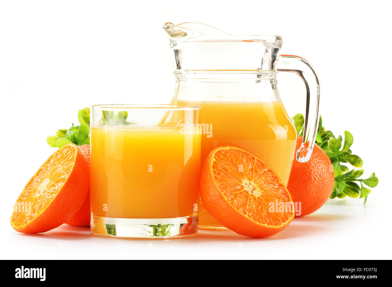 Composition with glass and jug of orange juice isolated on white Stock ...