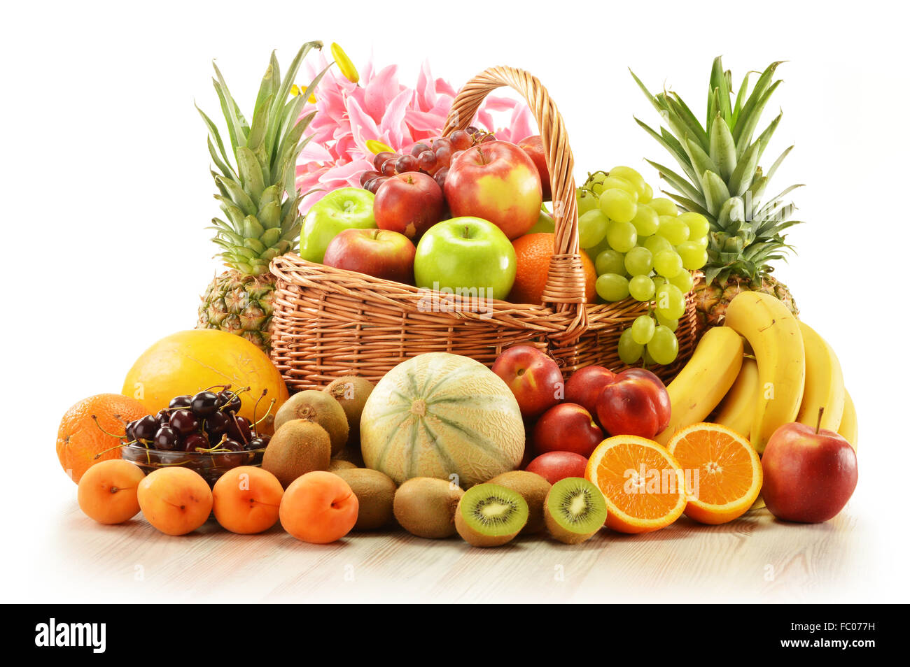 Composition with assorted fruits in wicker basket Stock Photo - Alamy