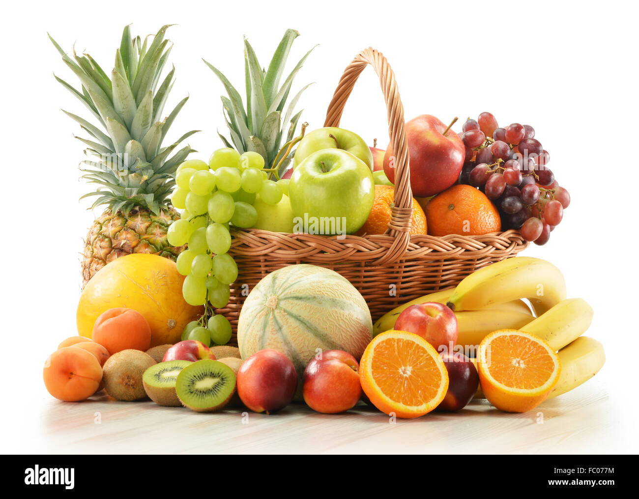 Composition with assorted fruits in wicker basket Stock Photo - Alamy