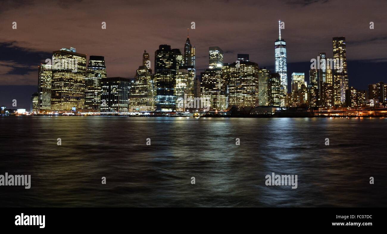 Downtown Manhattan and the Freedom Tower at night from Brooklyn Stock ...